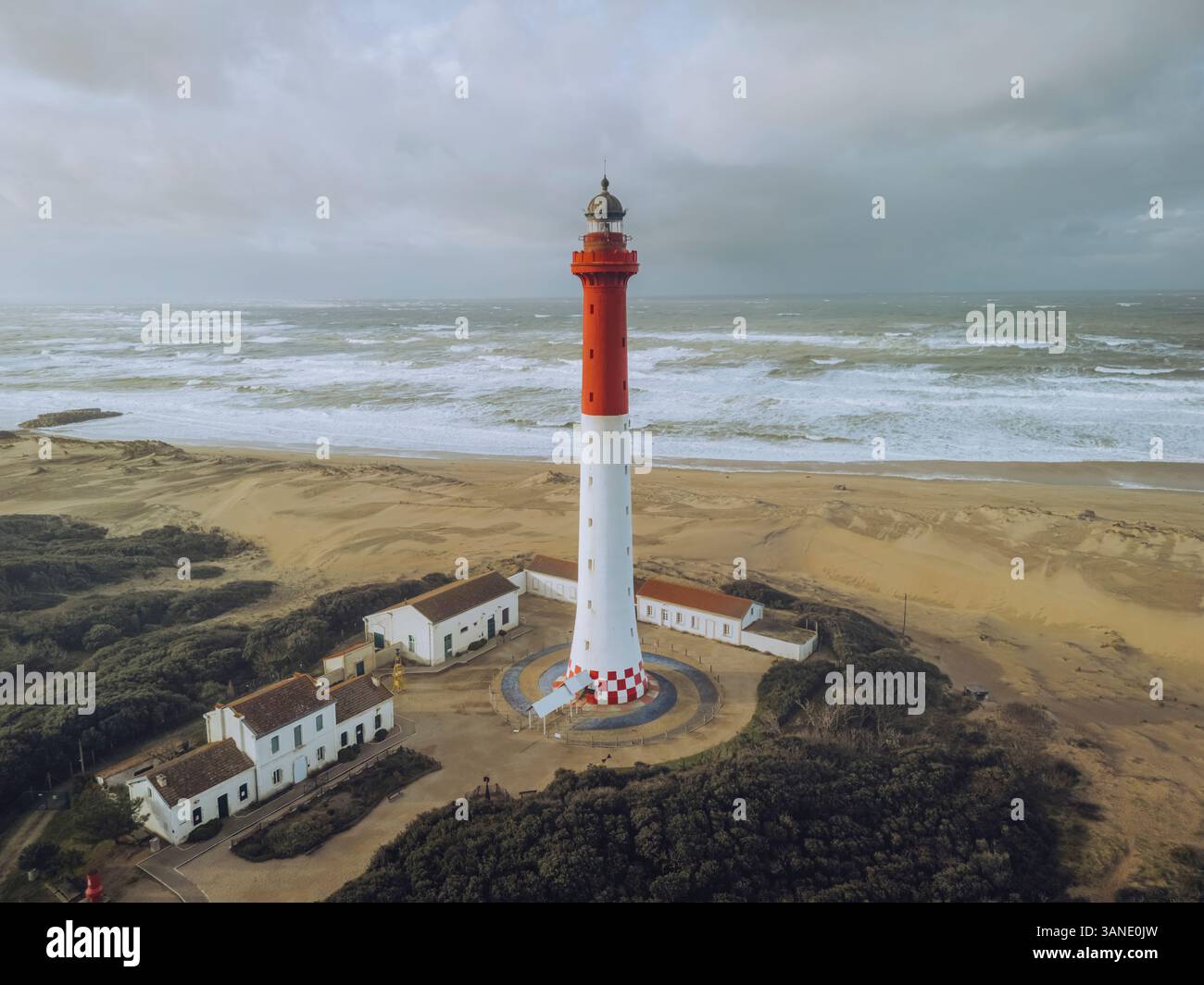 Aerial view of the beautiful Lighthouse of La Coubre on a sandy beach ...