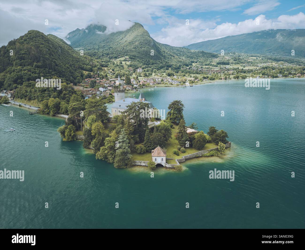 Aerial view of Lake Annecy with Chateau de Duingt surrounded by lush ...