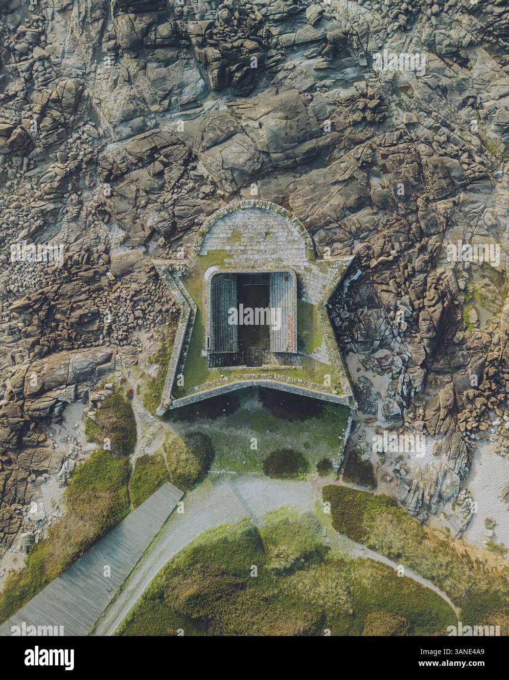 Aerial view of ancient Forte do Cao with moss-covered stone walls and ...