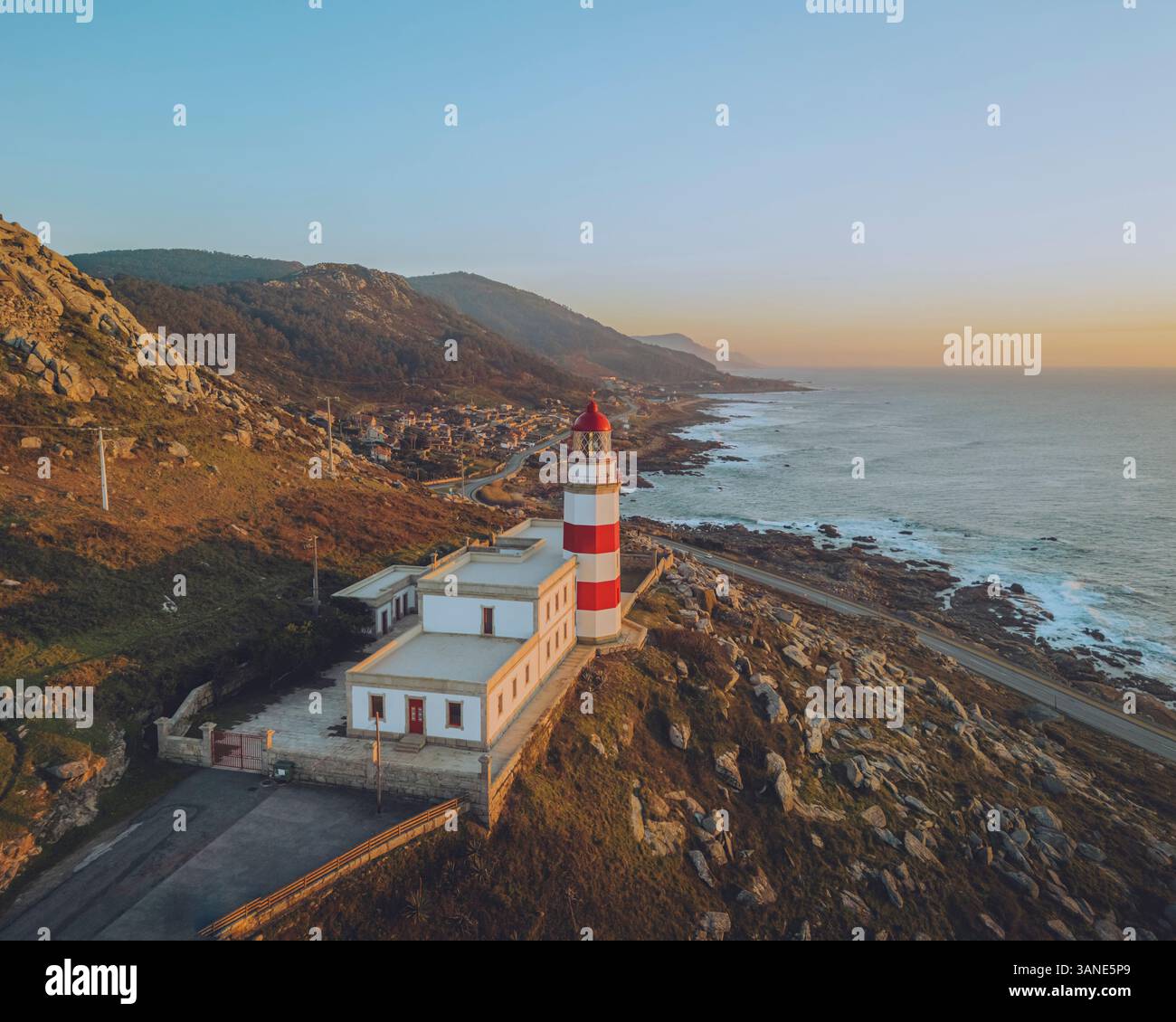 Aerial view of Faro de Cabo Silleiro and coastal lighthouse at dawn, A ...