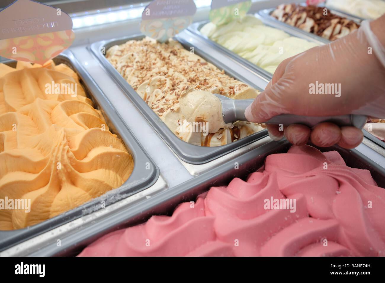 Shopping stalls selling ice cream with different fillings and flavors ...