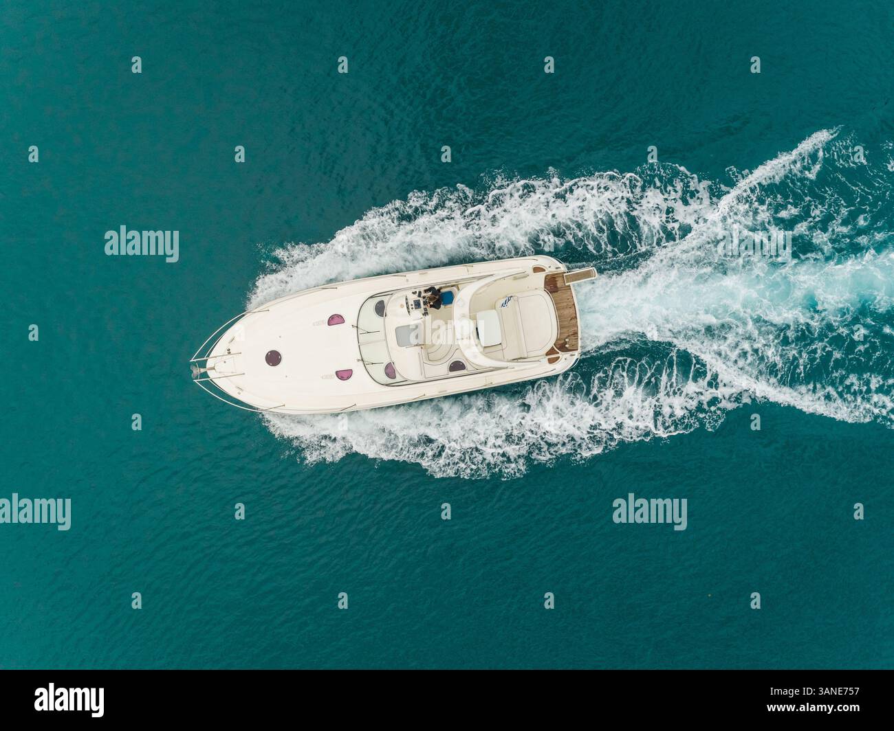 Aerial view of man driving boat in the mediterranean sea, Achaia ...