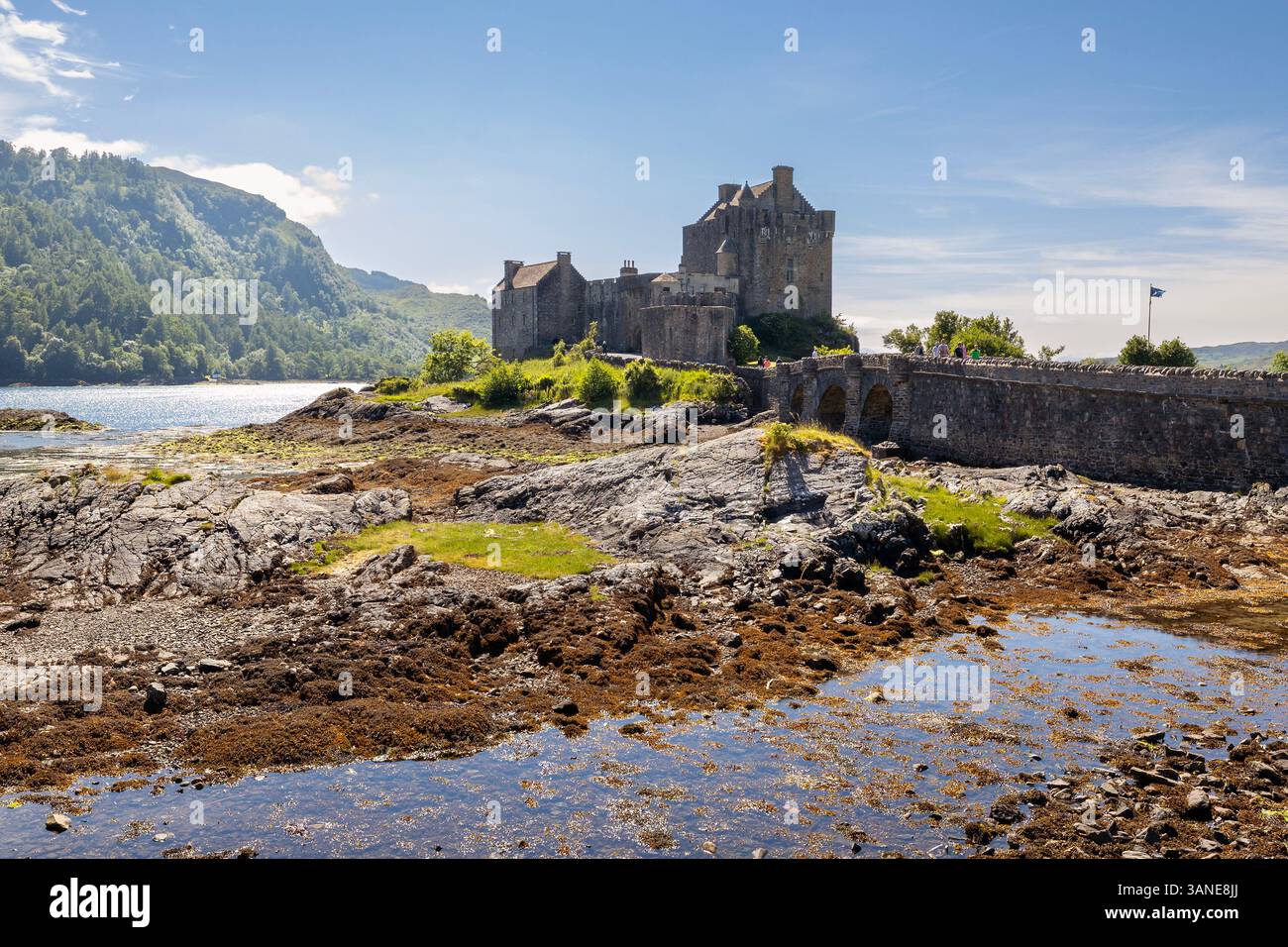 Eilean donan castle. bridge, scottish hills, loch, clear skies Stock ...