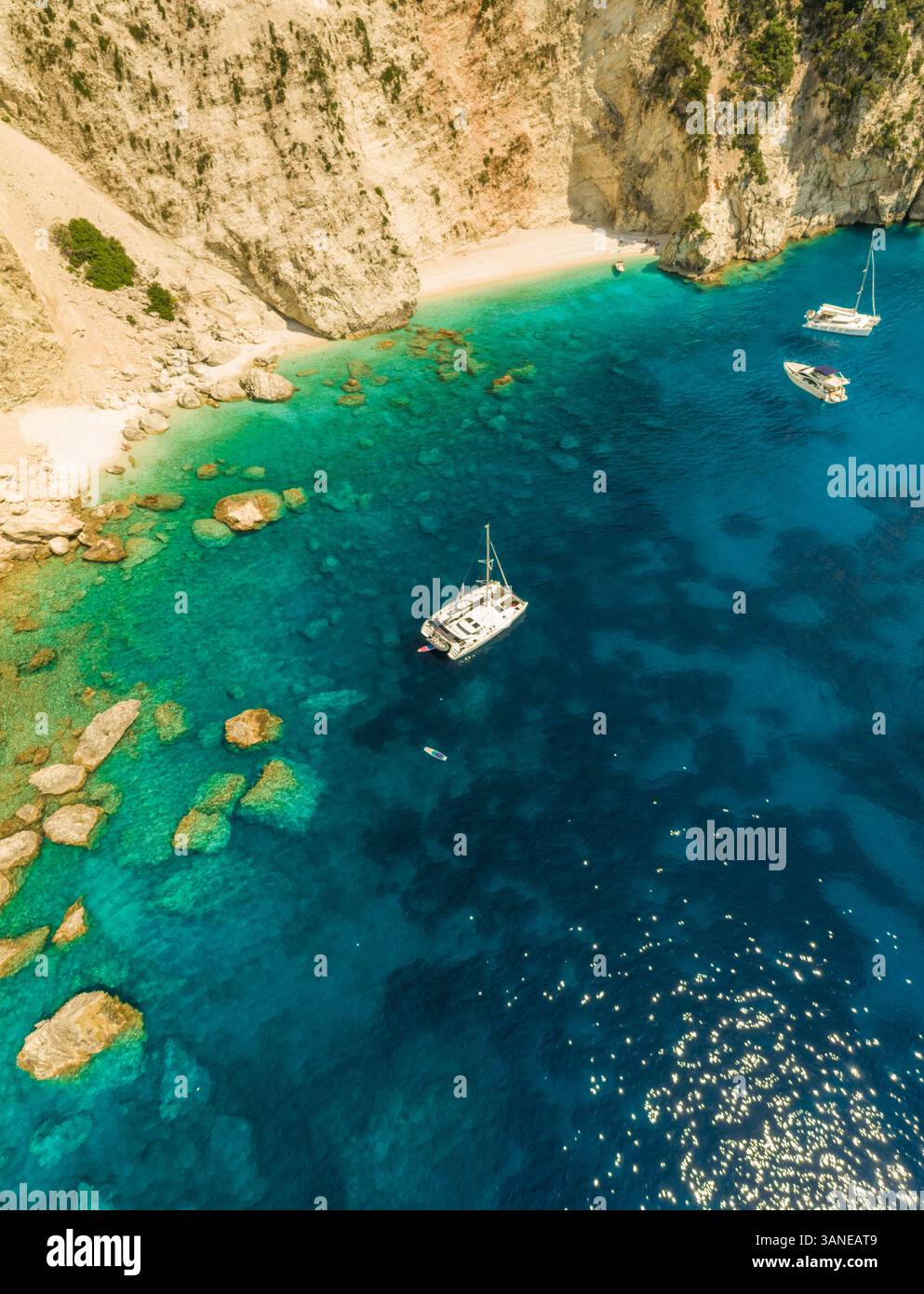 Aerial view group of boats anchored in rocky bay off the coast in ...