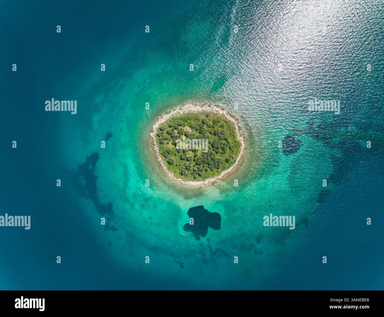 Aerial view of small islet of Itea called Agios Athanasios in Greece ...