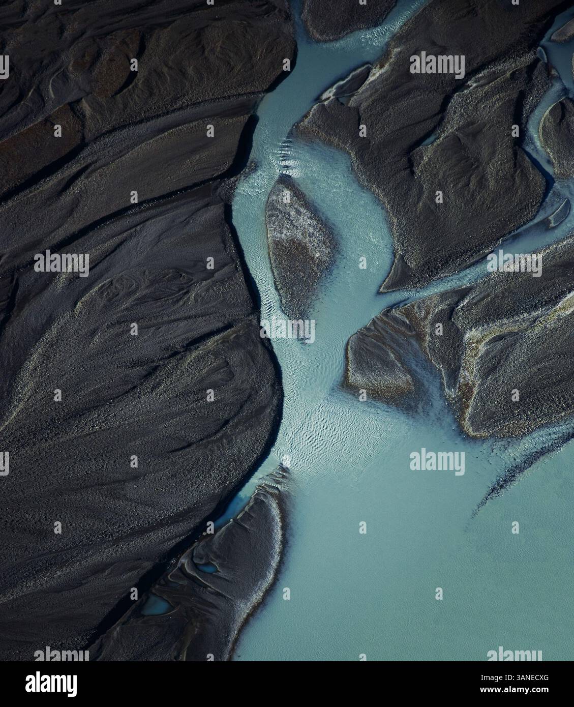 Aerial view of blue glacial rivers and textures melting from Tasman ...