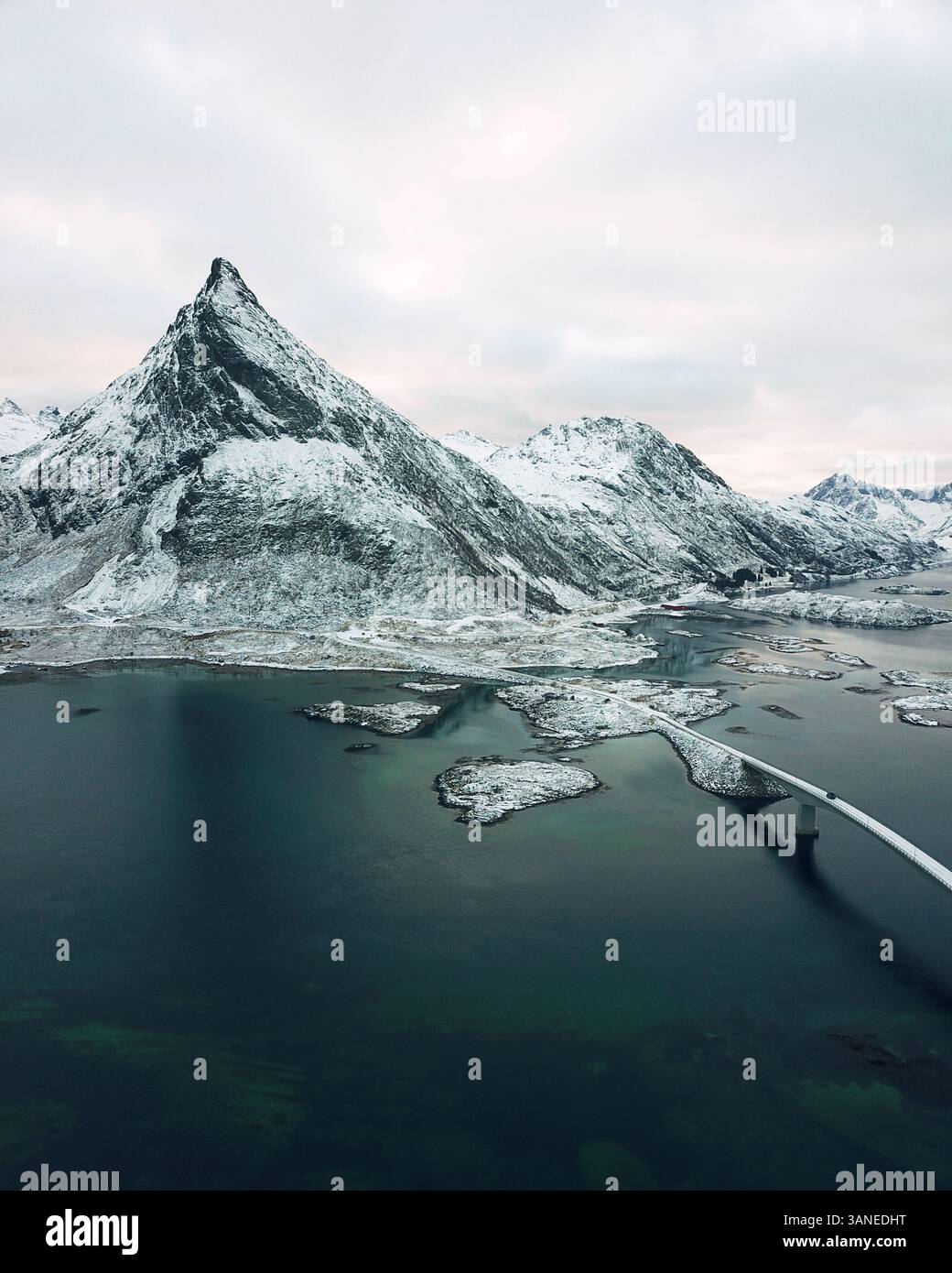 Aerial view of iconic Fredvang Bridges and snowy mountains, Lofoten ...
