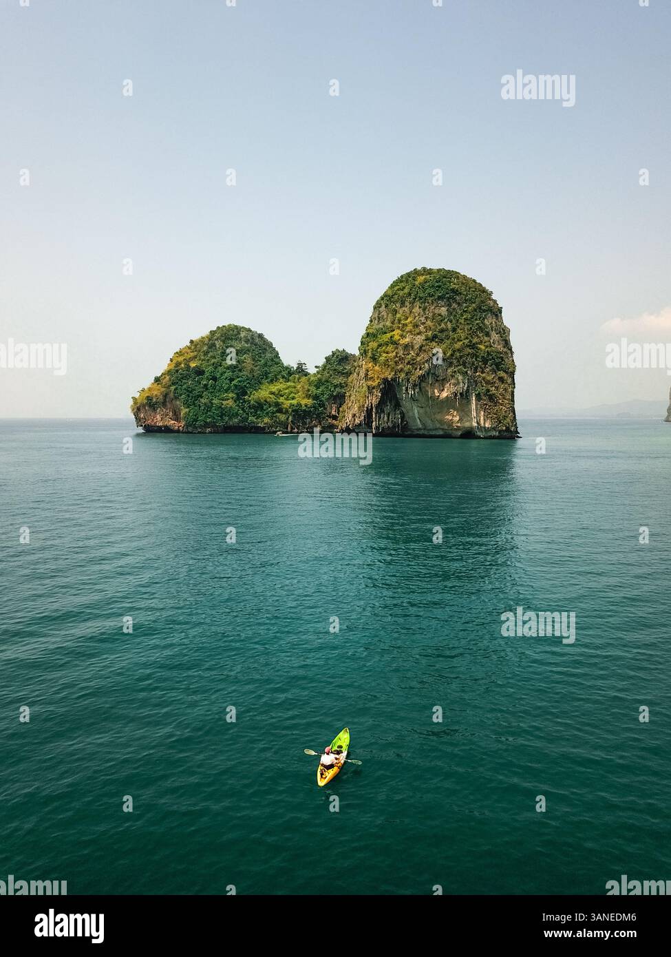 Aerial view of kayaks and canoes exploring the giant limestone cliffs ...