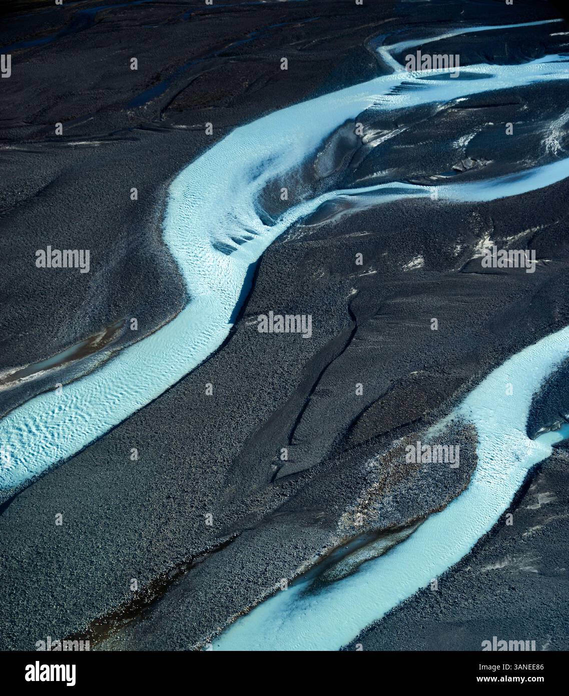 Aerial view of blue glacial rivers and textures melting from Tasman ...