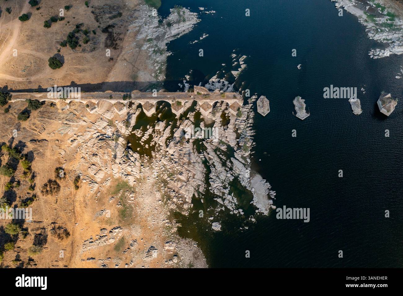 Aerial view of Puente Ayuda, a collapsed stone bridge crossing the ...