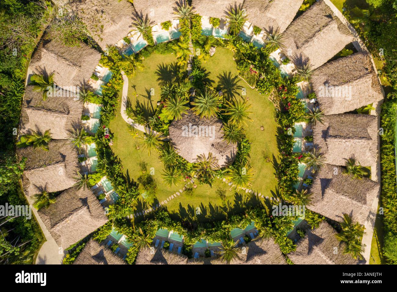 Aerial view of circular shaped luxury resort with swimming pools in the ...