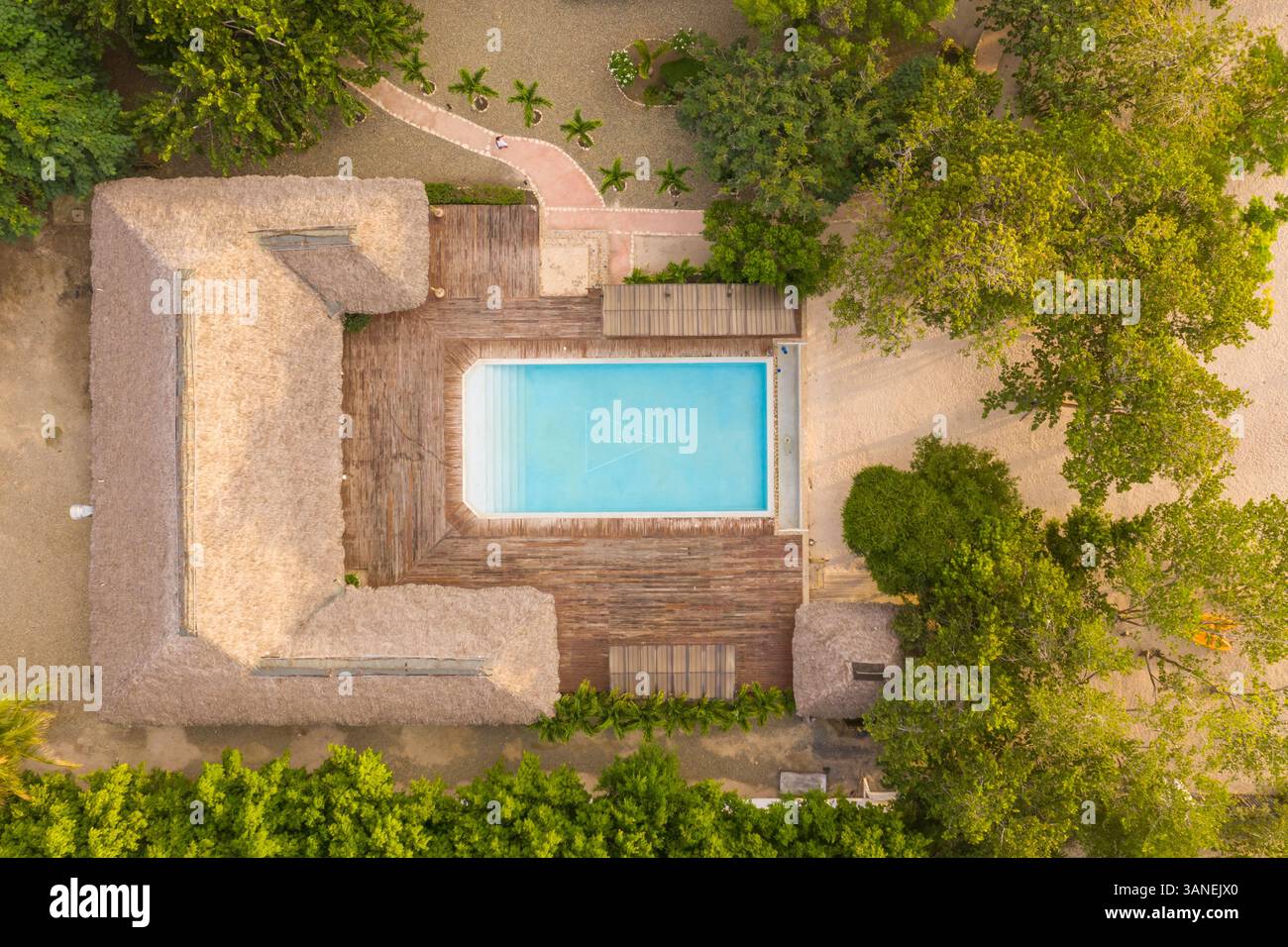 Aerial view of a luxury resort on a tropical island with swimming pool ...