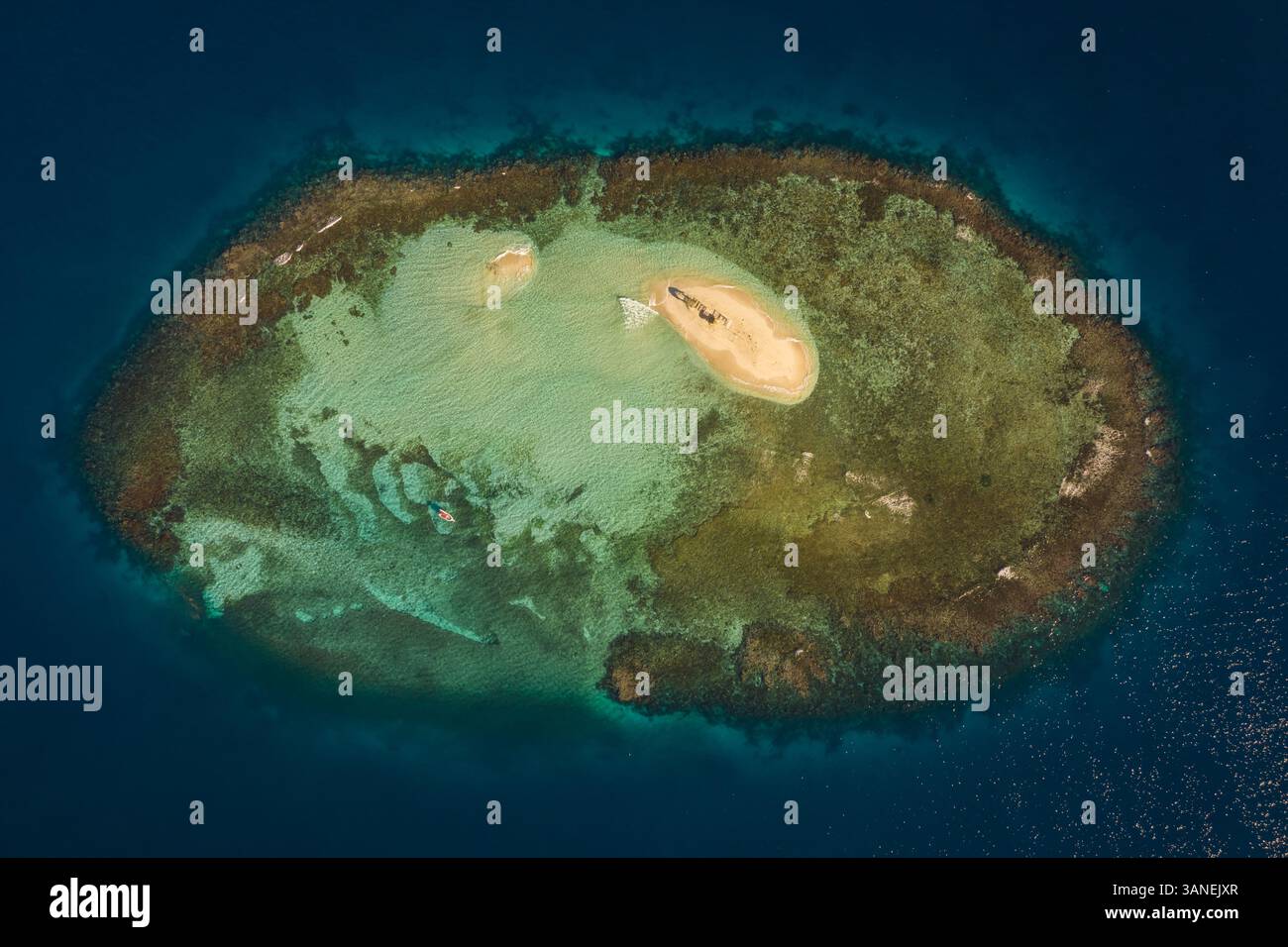Aerial view of a small isolated wooden hut on the little island of Cayo ...