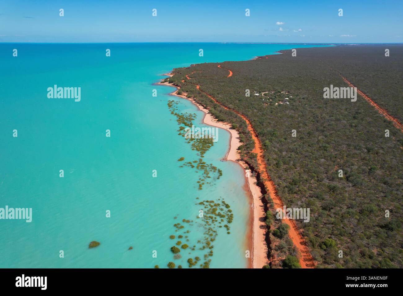 Aerial view of red sand beach and turquoise ocean at Roebuck Bay ...