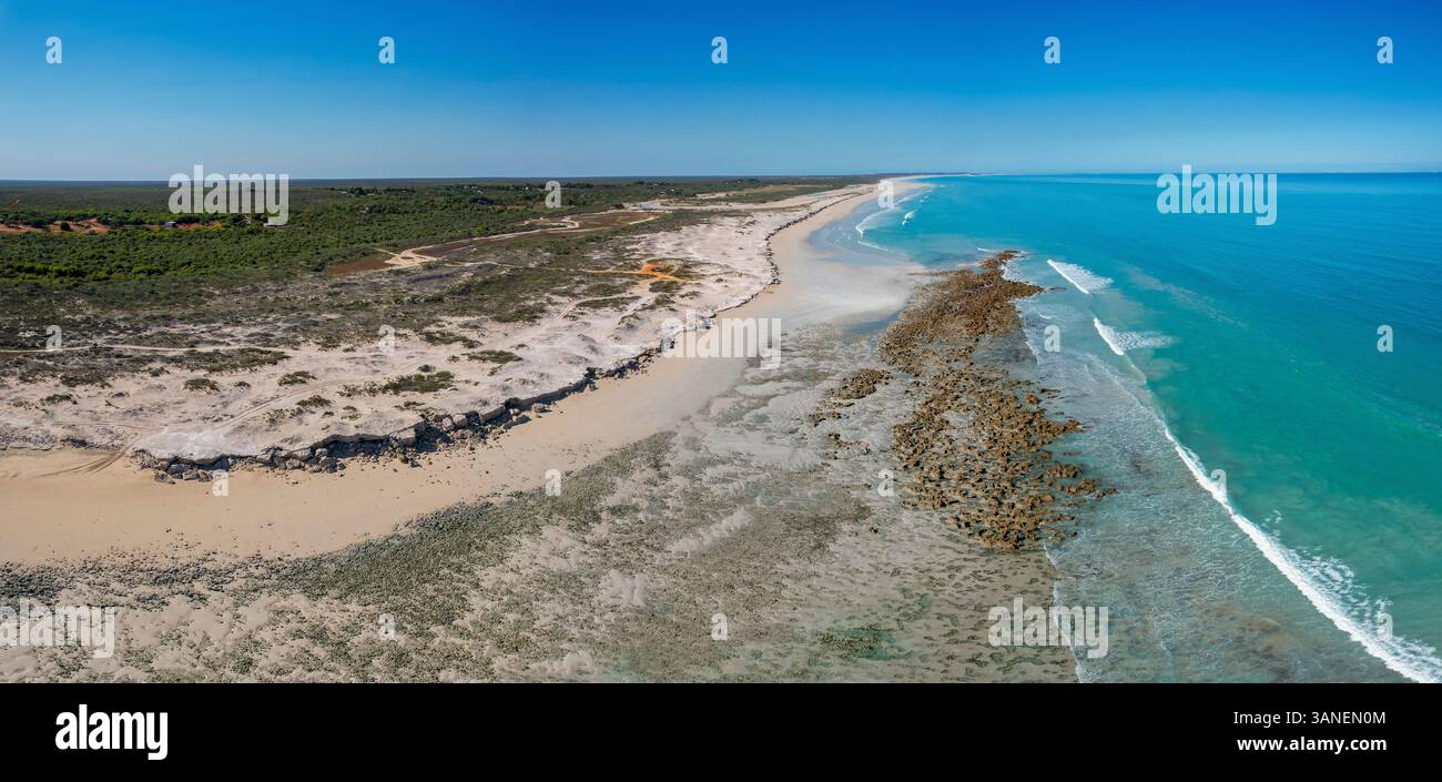 Aerial view of coconut well rock pools and pristine beach with ...