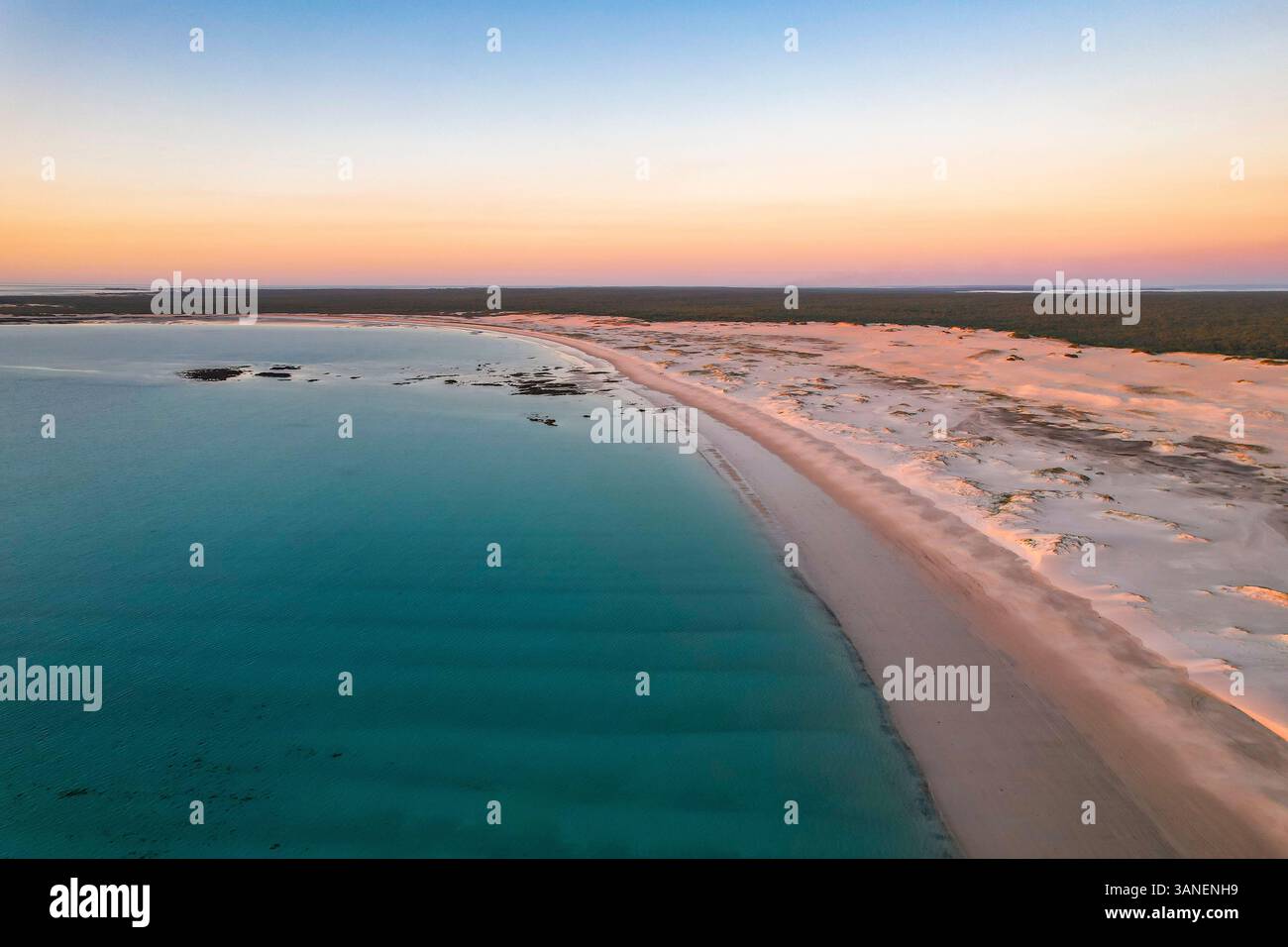 Aerial view of tranquil Thomas Bay with pristine beach and azure ocean ...