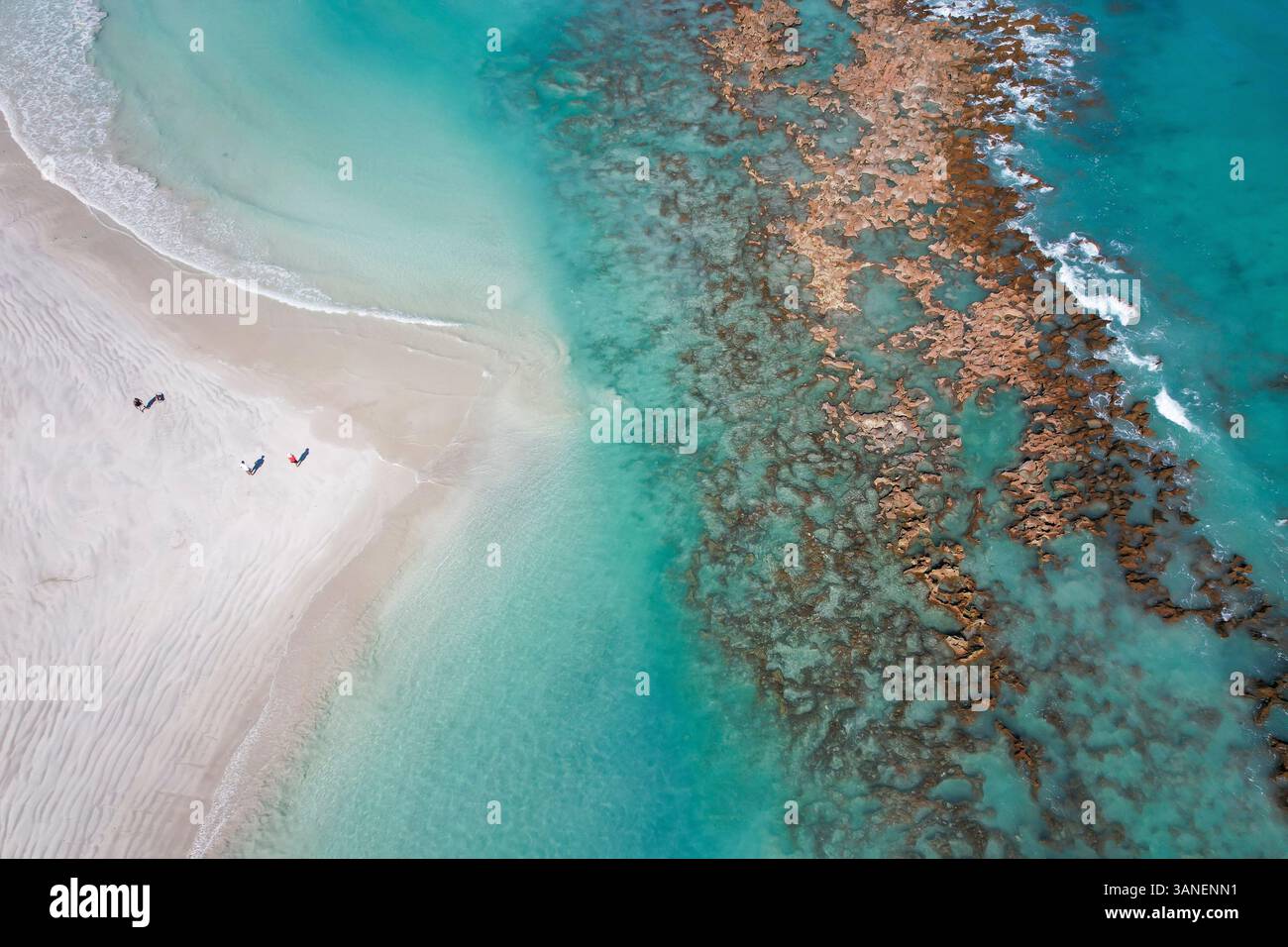 Aerial view of coconut well rock pools with beachgoers on a serene ...