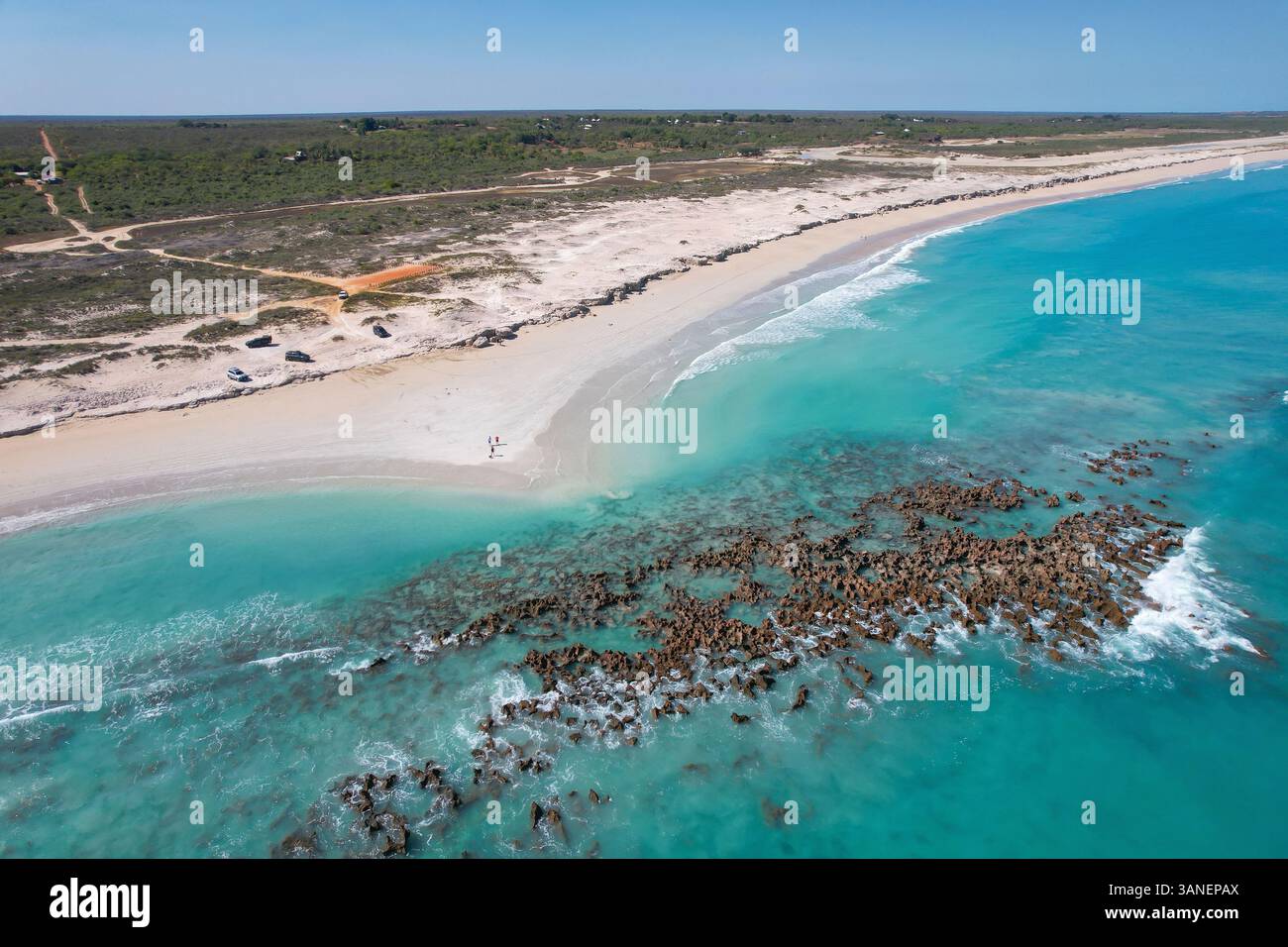 Aerial view of coconut well rock pools with beachgoers and turquoise ...