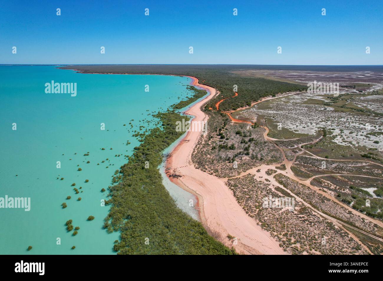 Aerial view of red sand beach and turquoise water at Roebuck Bay ...
