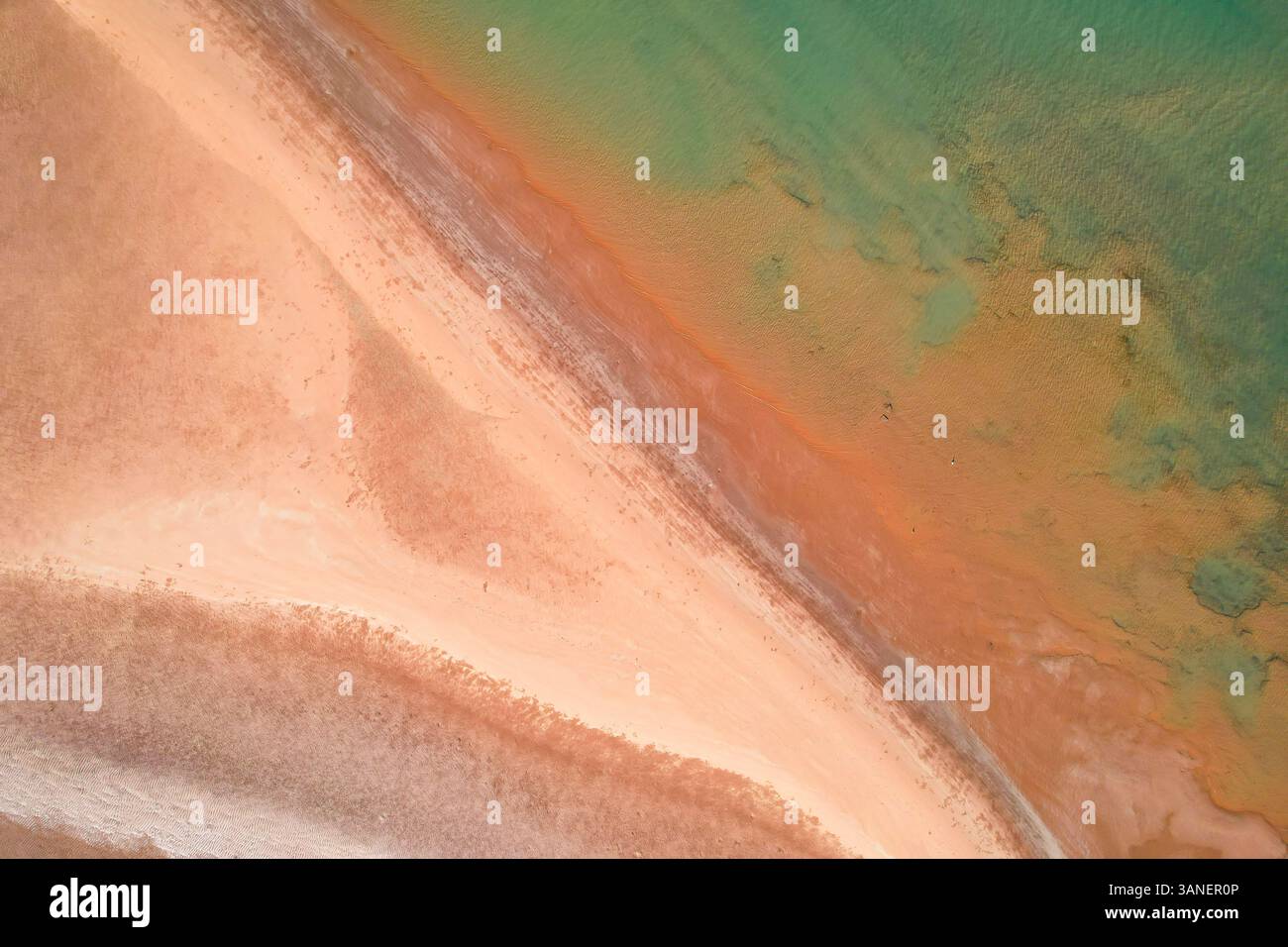 Aerial view of the serene Nullagine River with turquoise water and ...