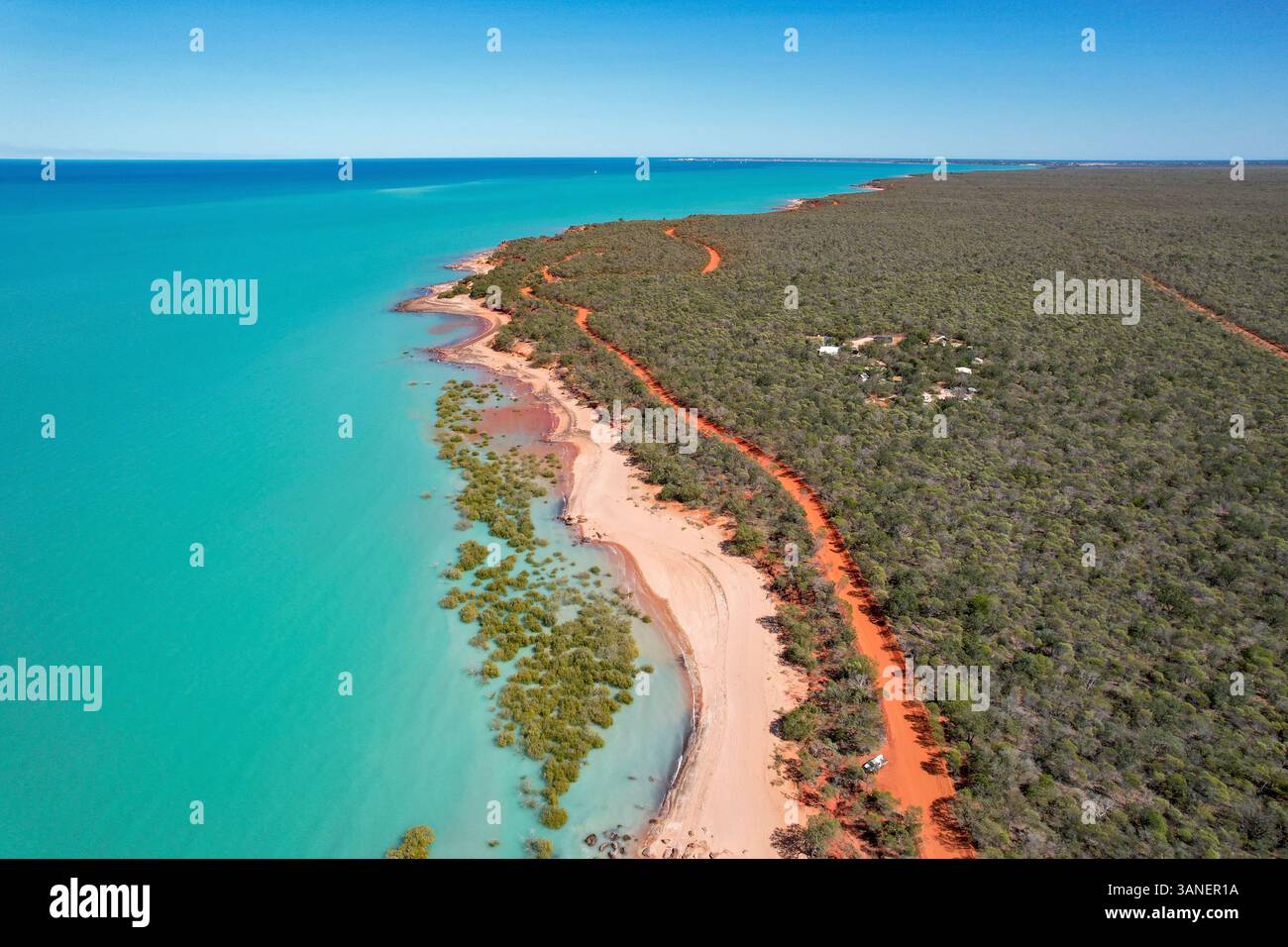 Aerial view of red sand beach and turquoise ocean at Roebuck Bay ...