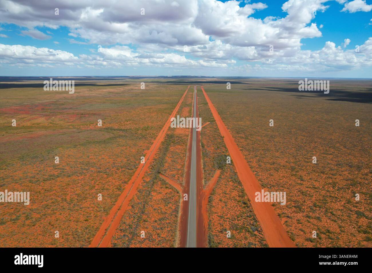 Aerial view of the winding Great Northern Highway through arid desert ...