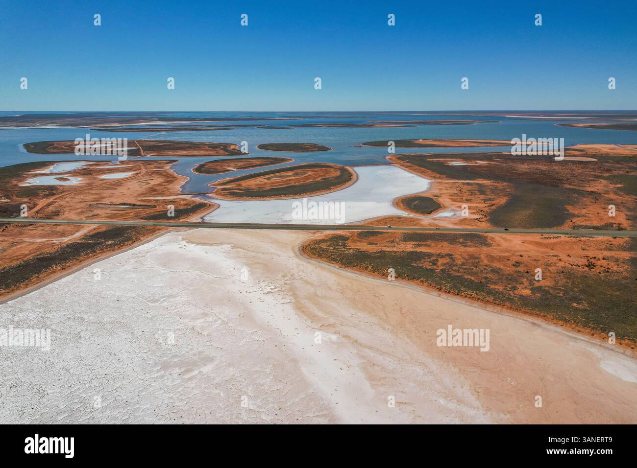 Aerial view of salt ponds in the Pilbara Region with vast red earth and ...