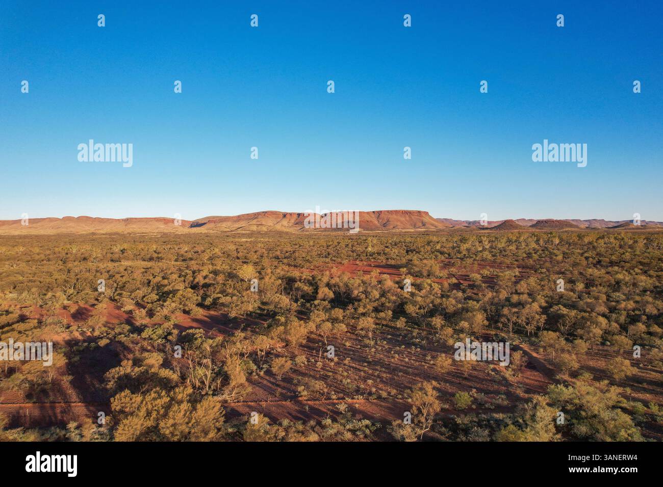 Aerial view of rugged desert landscape with rock formations and vast ...
