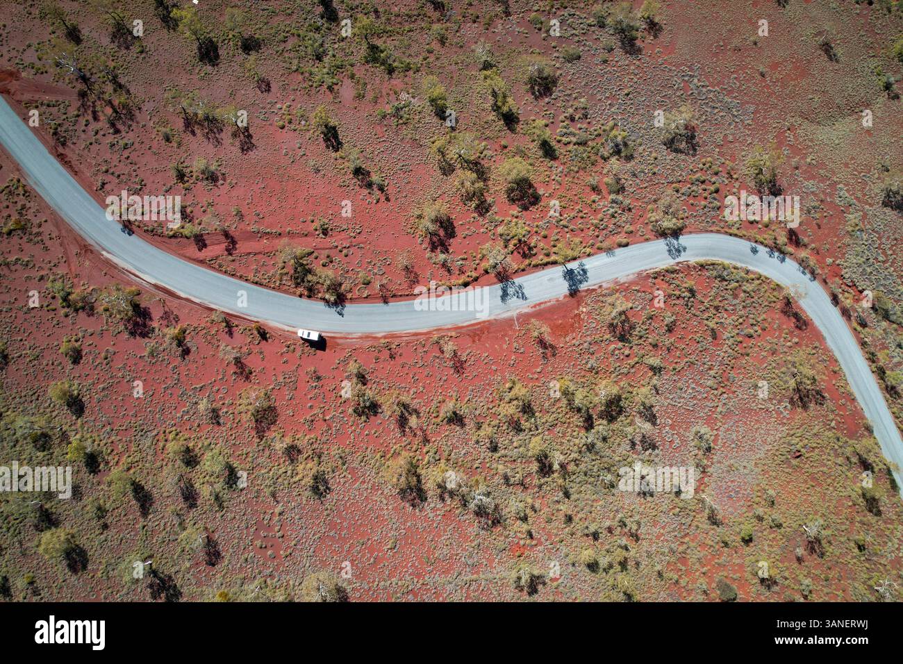 Aerial view of Weano Road with a campervan amidst the rugged red earth ...
