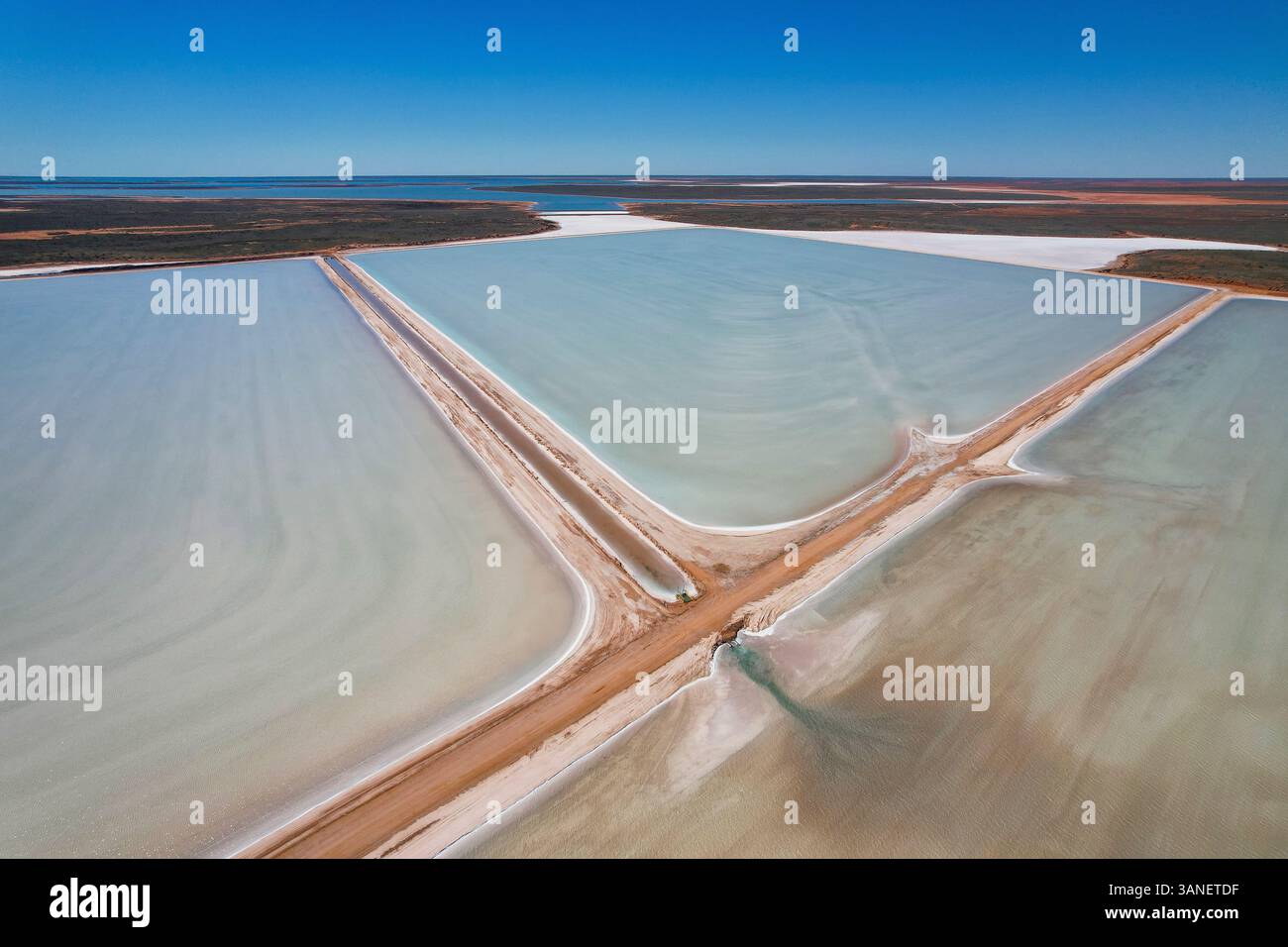 Aerial view of colorful salt pond with abstract patterns and textures ...
