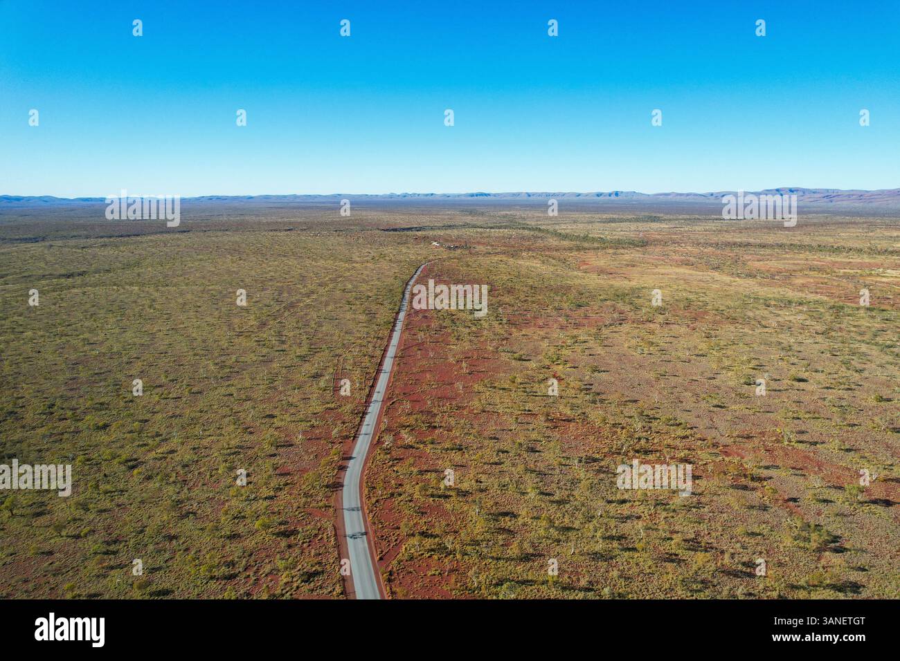 Aerial view of winding Weano Road through vast and rugged landscape ...