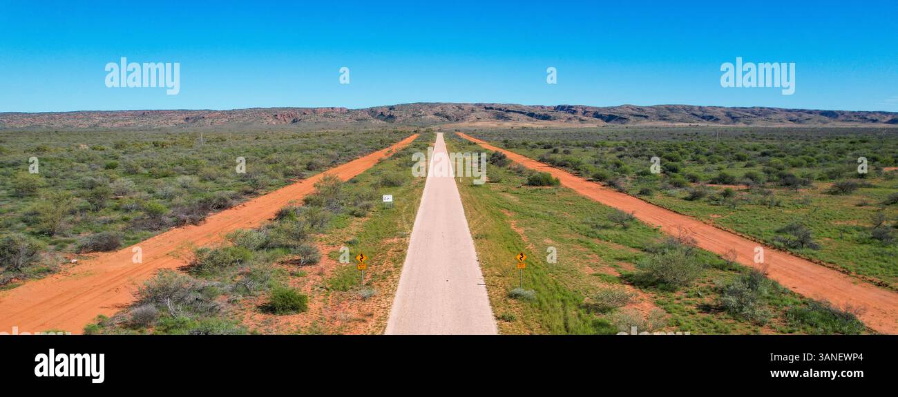 Aerial view of winding road through arid landscape with beautiful ...