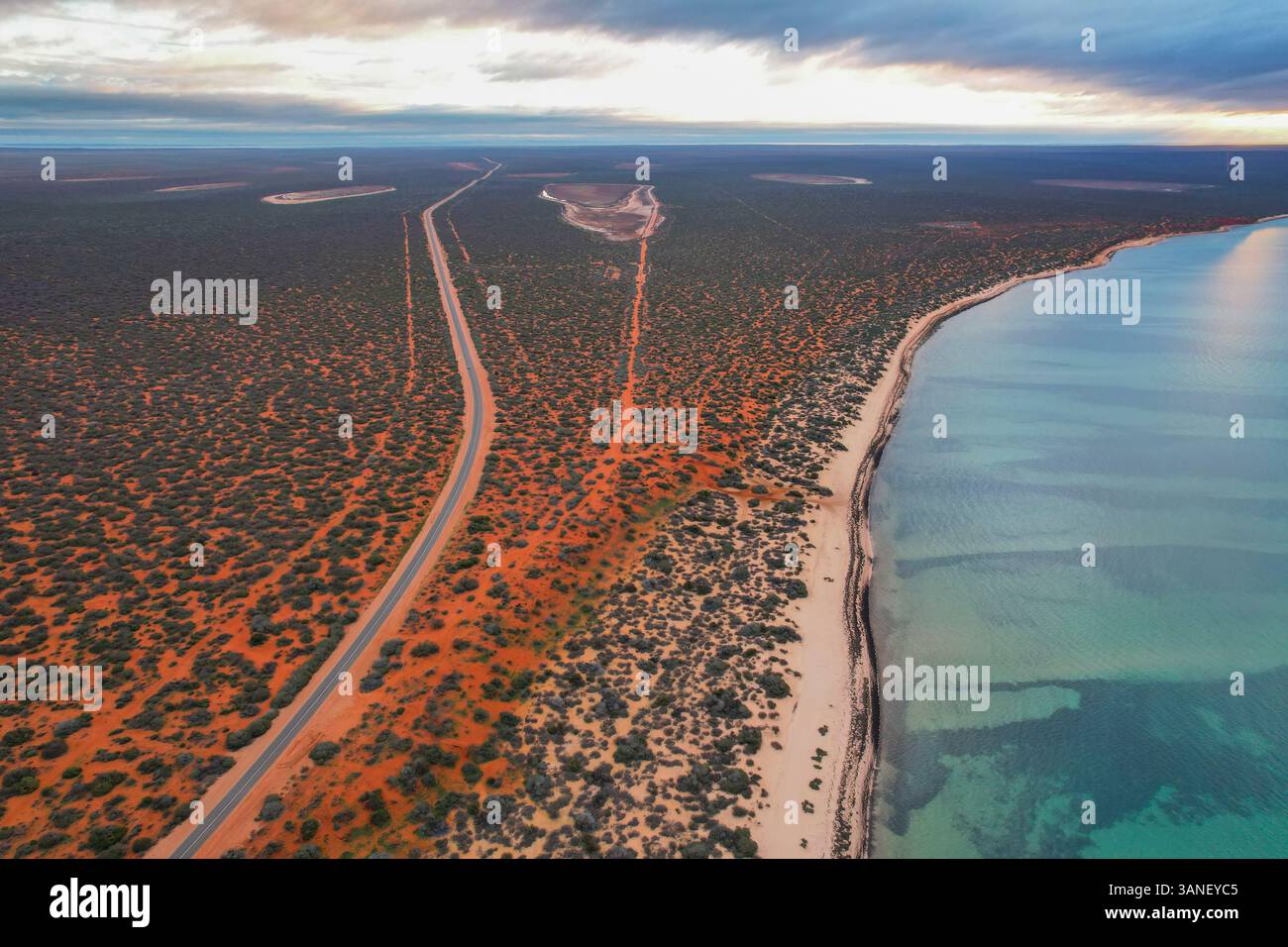 Aerial view of the beautiful coastline and ocean with red earth and ...