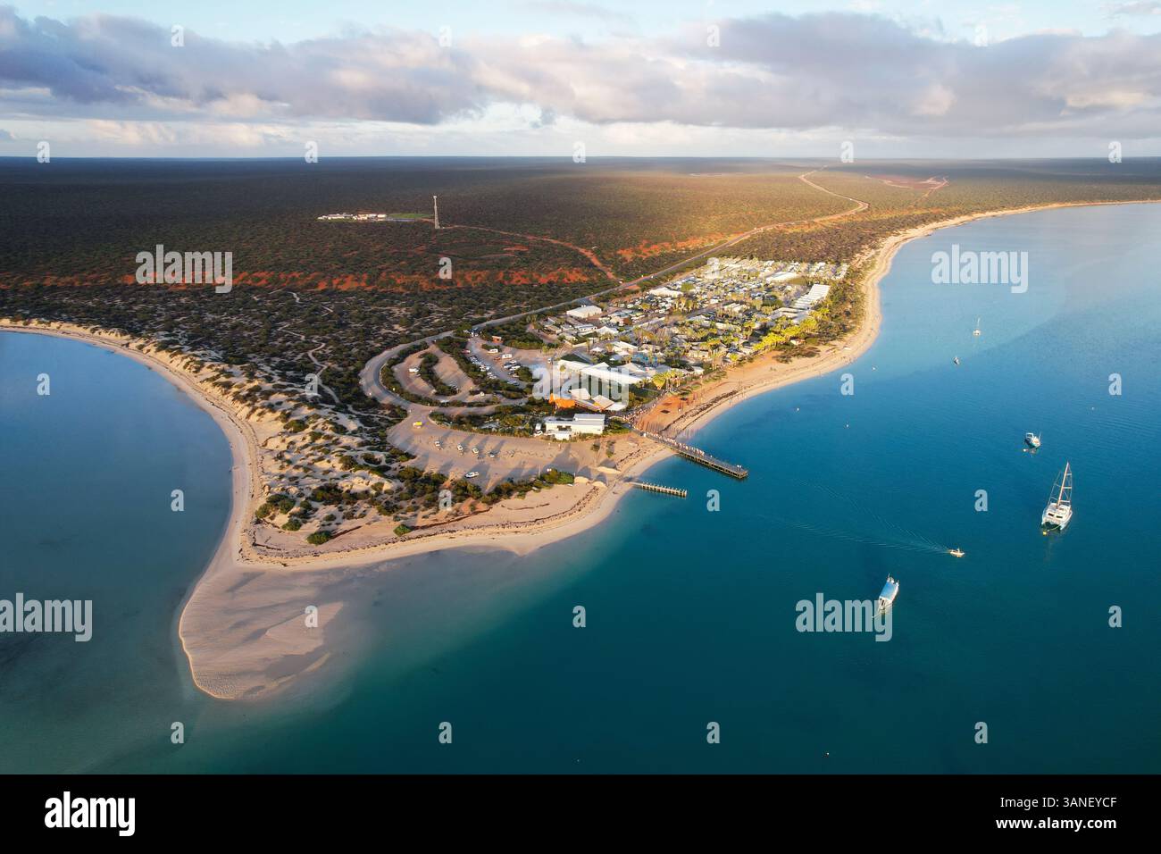 Aerial view of serene Shark Bay with RAC Monkey Mia Dolphin Resort ...