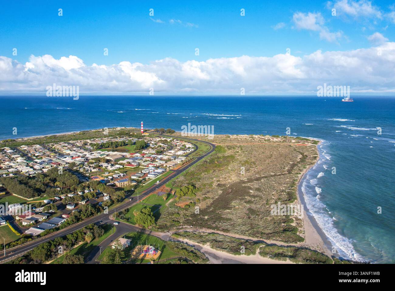 Aerial view of the beautiful coastline featuring Point Moore Lighthouse and sandy beach ...