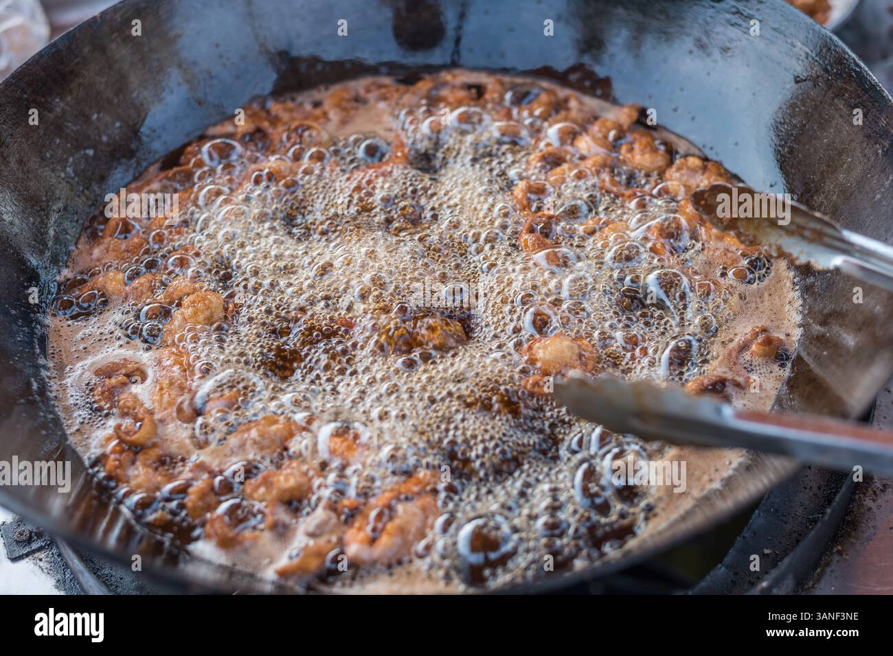 Fried a food by deep fry with boiling oil in pot or pan for sale at ...