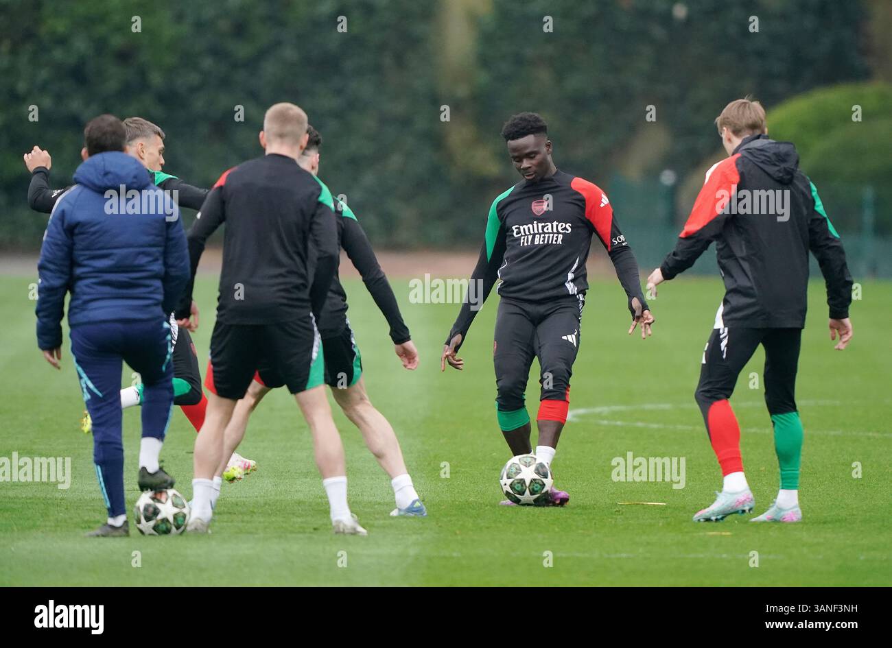 Arsenal's Bukayo Saka (centre right) during a training session at the ...