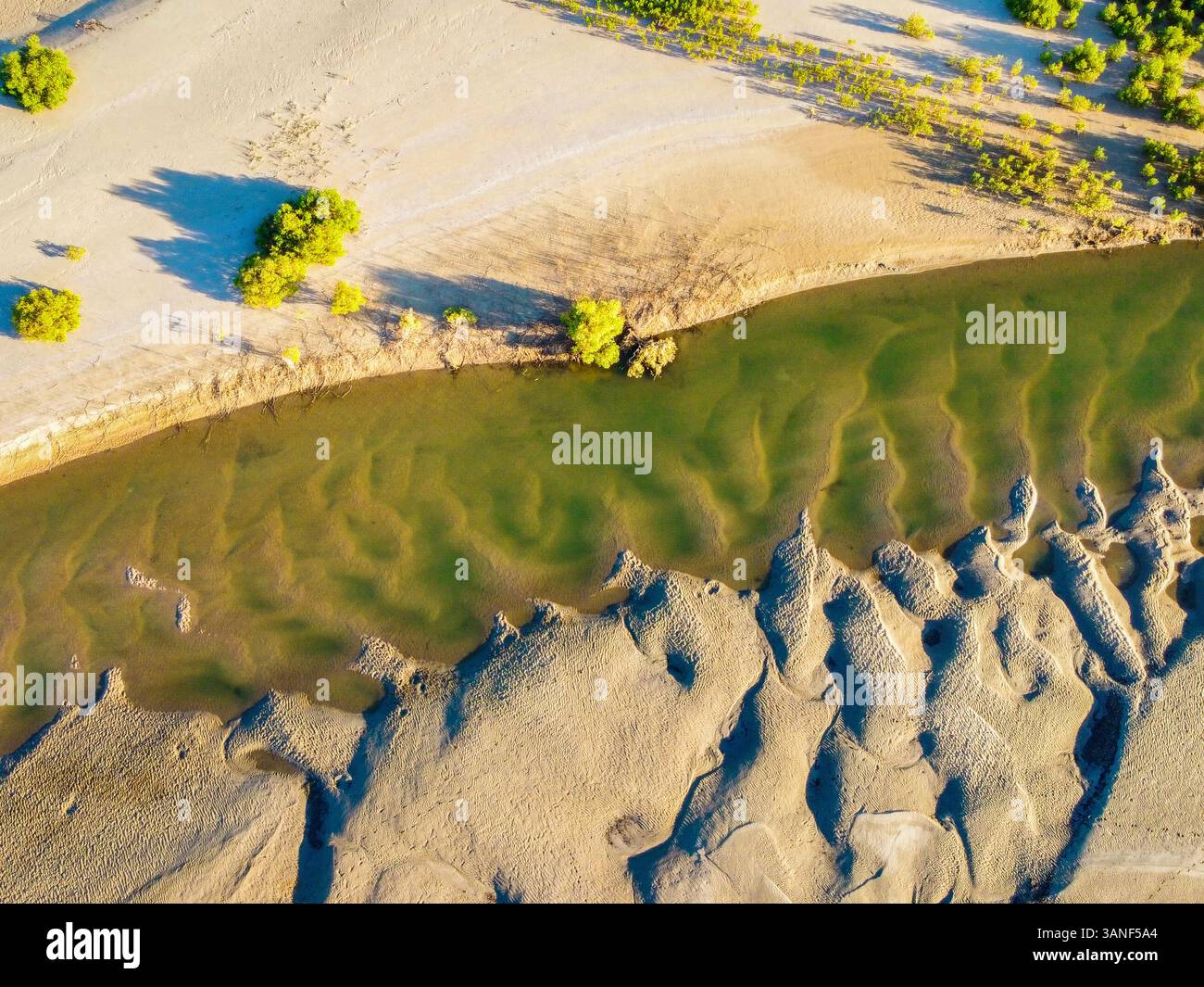 Aerial view of serene river, sandy beach, and lush vegetation, Kinka ...