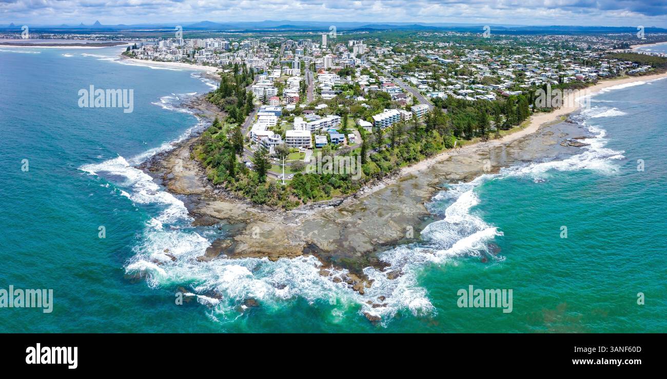 Aerial view of beach town with ocean, buildings, and trees, Caloundra ...