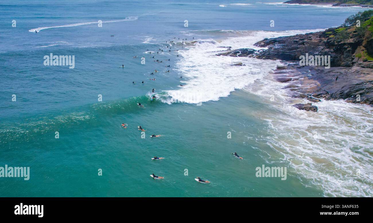 Aerial view of surfers at Tea Tree Bay Beach, Noosa Heads, Queensland ...