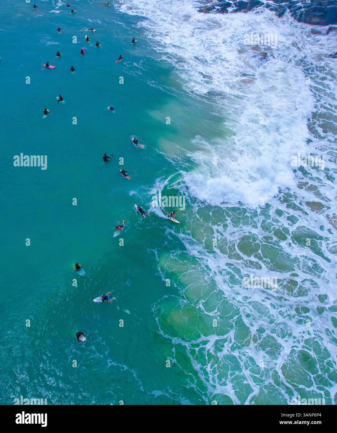 Aerial view of surfers at Dolphin Point Lookout, Tea Tree Bay, Noosa ...