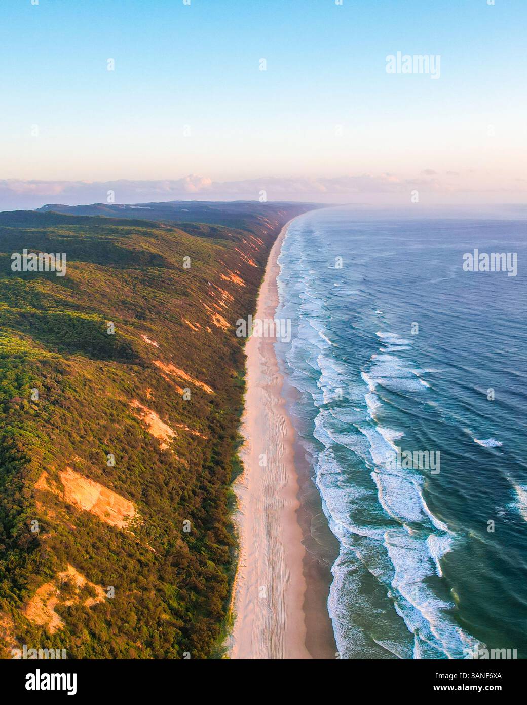 Aerial drone view of Teewah Beach at sunrise in Cooloola National Park ...