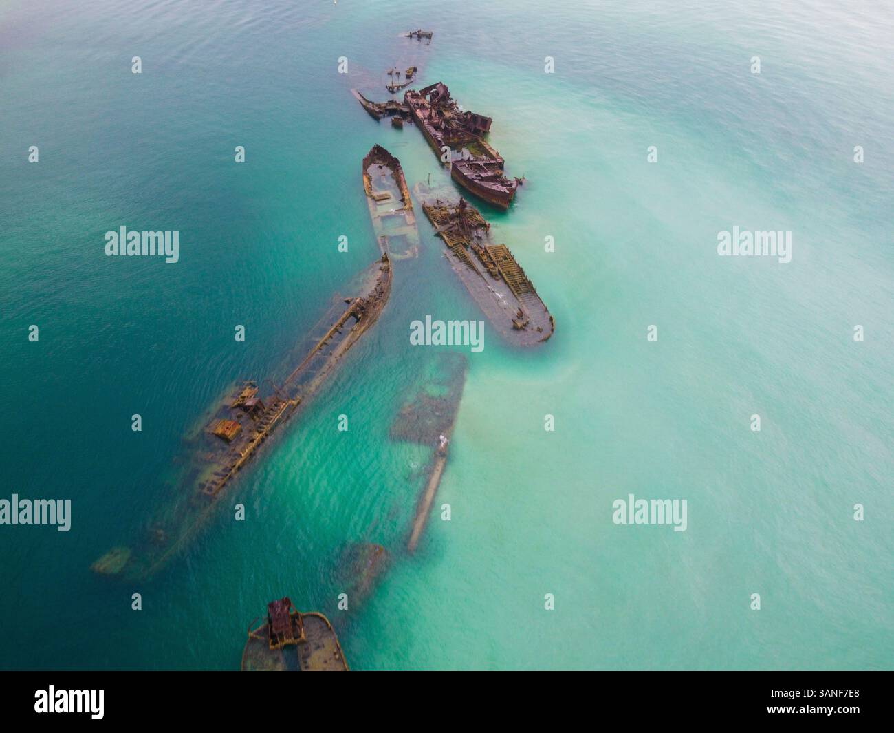 Aerial view of rusty shipwrecks at Tangalooma Wrecks, Moreton Bay ...