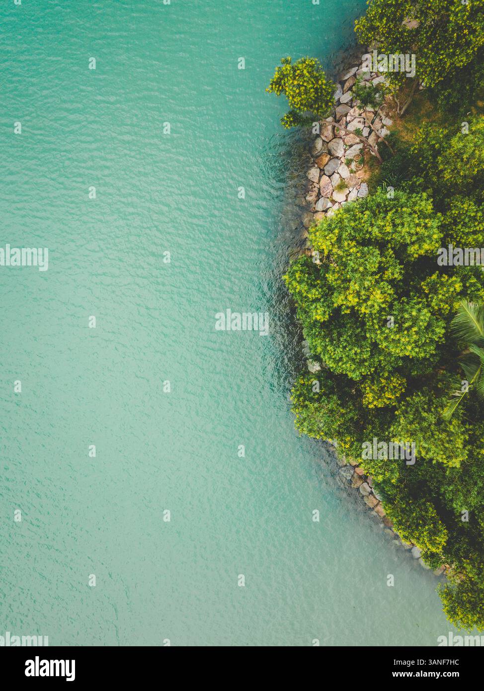 Aerial view of ocean, coastline and palm trees at the Tanjong Beach ...
