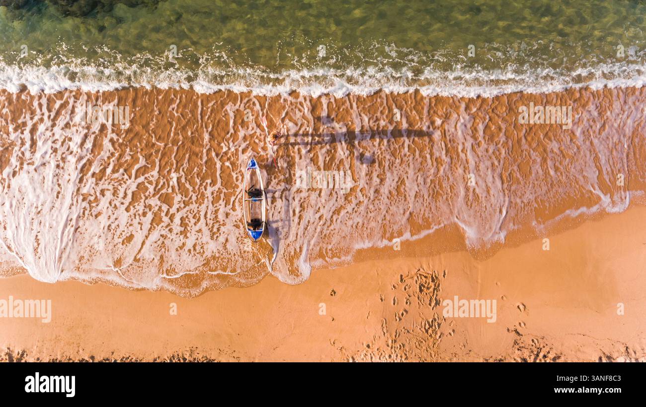 Aerial view of people walking with a kayak at Sant Pol beach, Girona ...