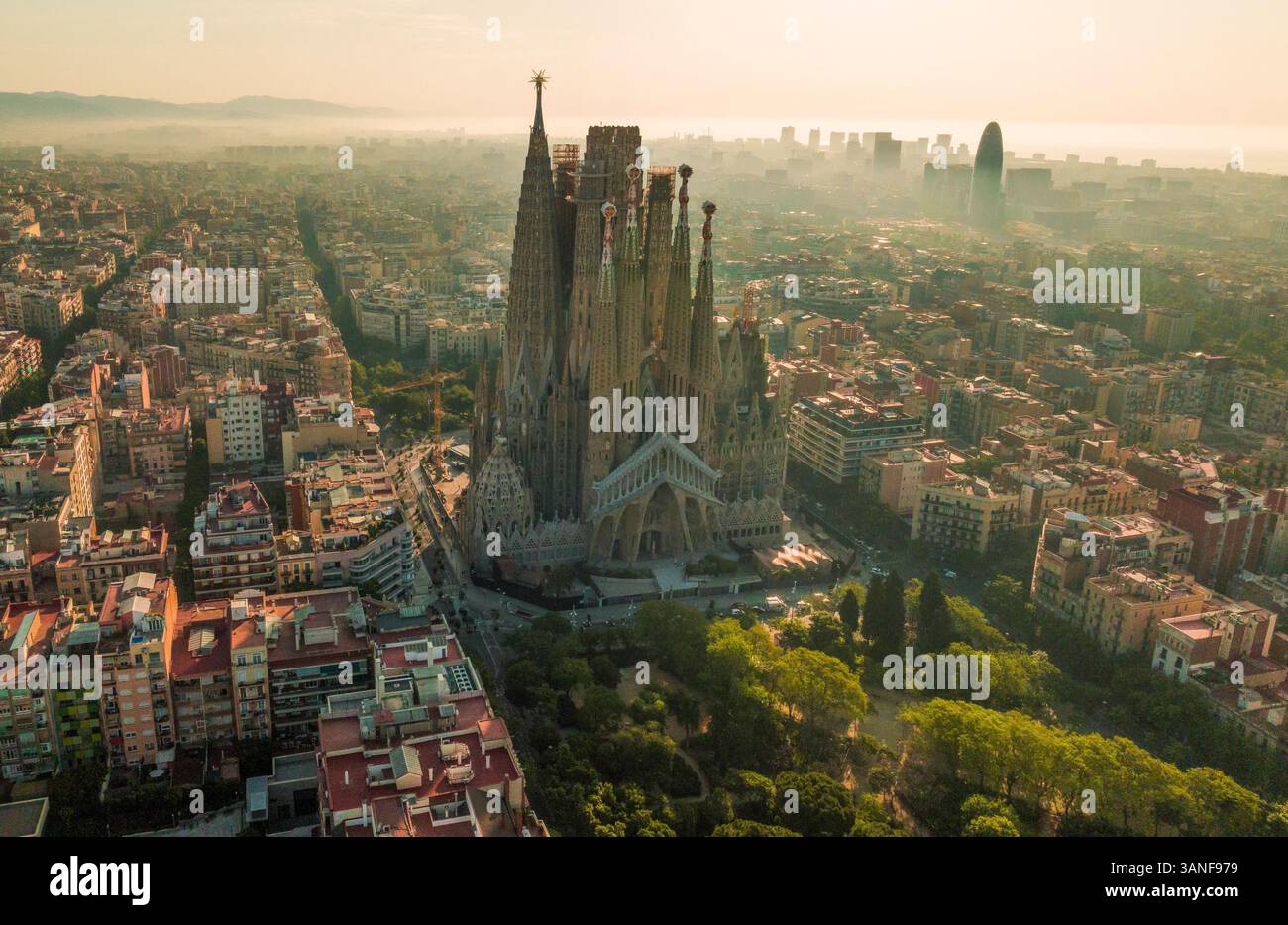 Aerial view of the beautiful Sagrada Familia and modern skyline in ...