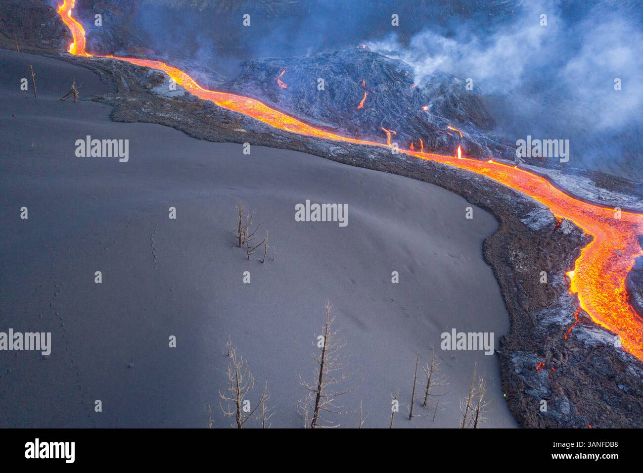 Aerial top down view of lava floating down the Volcan Cumbre Vieja, a ...