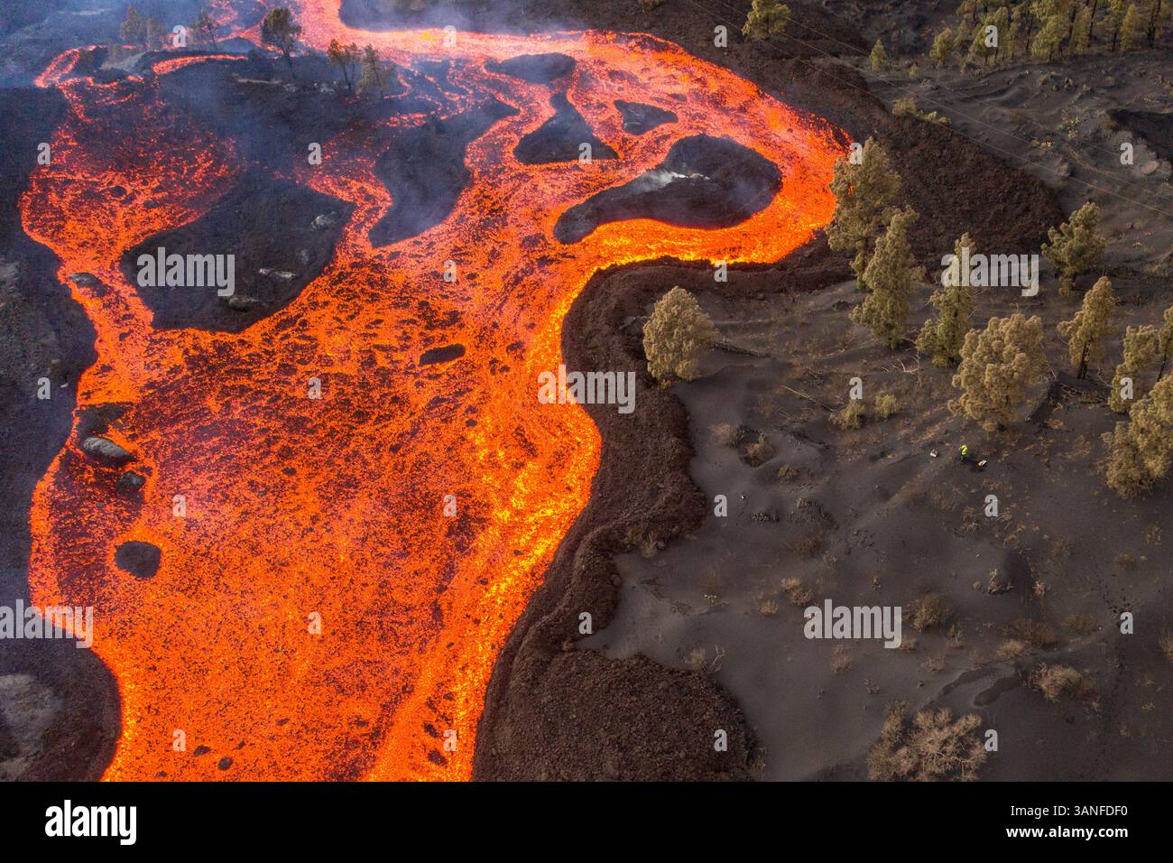 Aerial top down view of lava floating down the Volcan Cumbre Vieja, a ...
