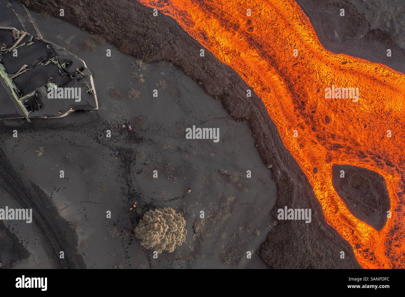 Aerial top down view of lava floating down the Volcan Cumbre Vieja, a ...