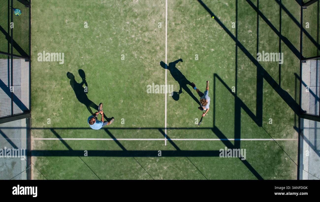 Aerial view of two people playing paddle in a tennis court at Papalus ...